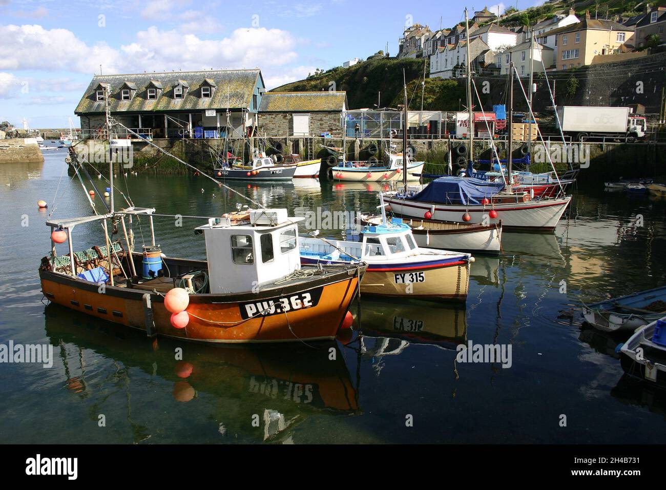 Mevagissey Cornwall England with mackerel fishing boats in the harbour ...