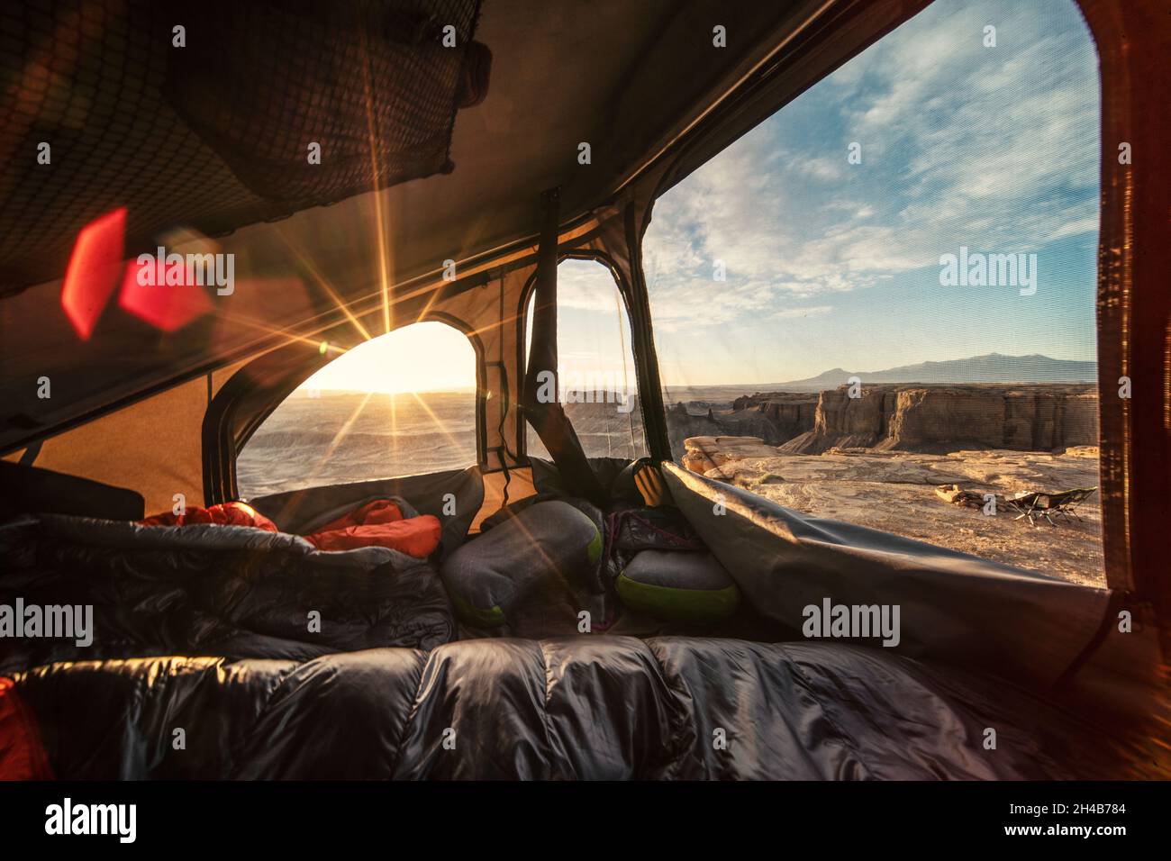 Rooftop tent overlooking desert canyon Stock Photo - Alamy