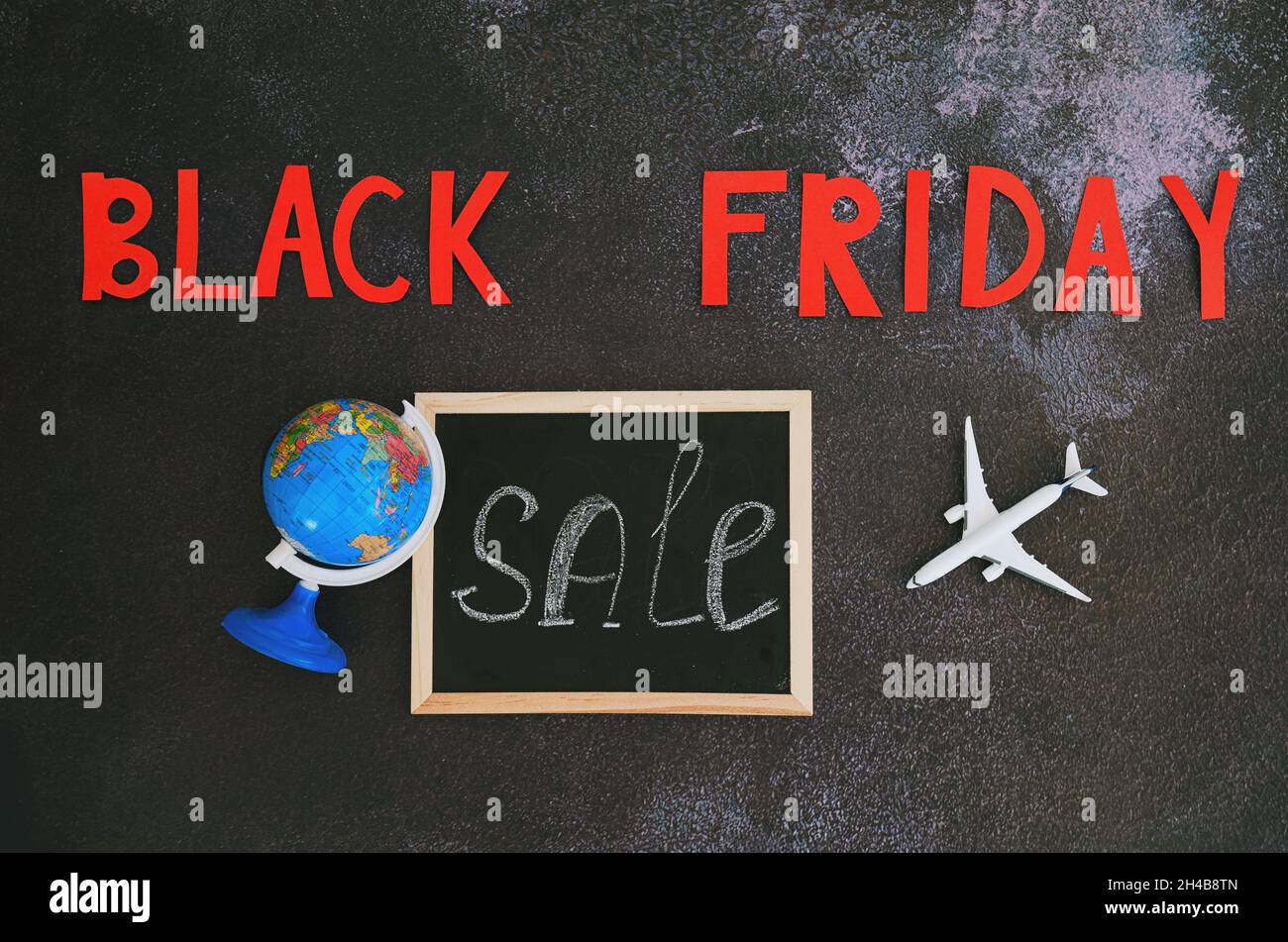 Black Friday concept. Inscription "black friday", globe, writing board ...