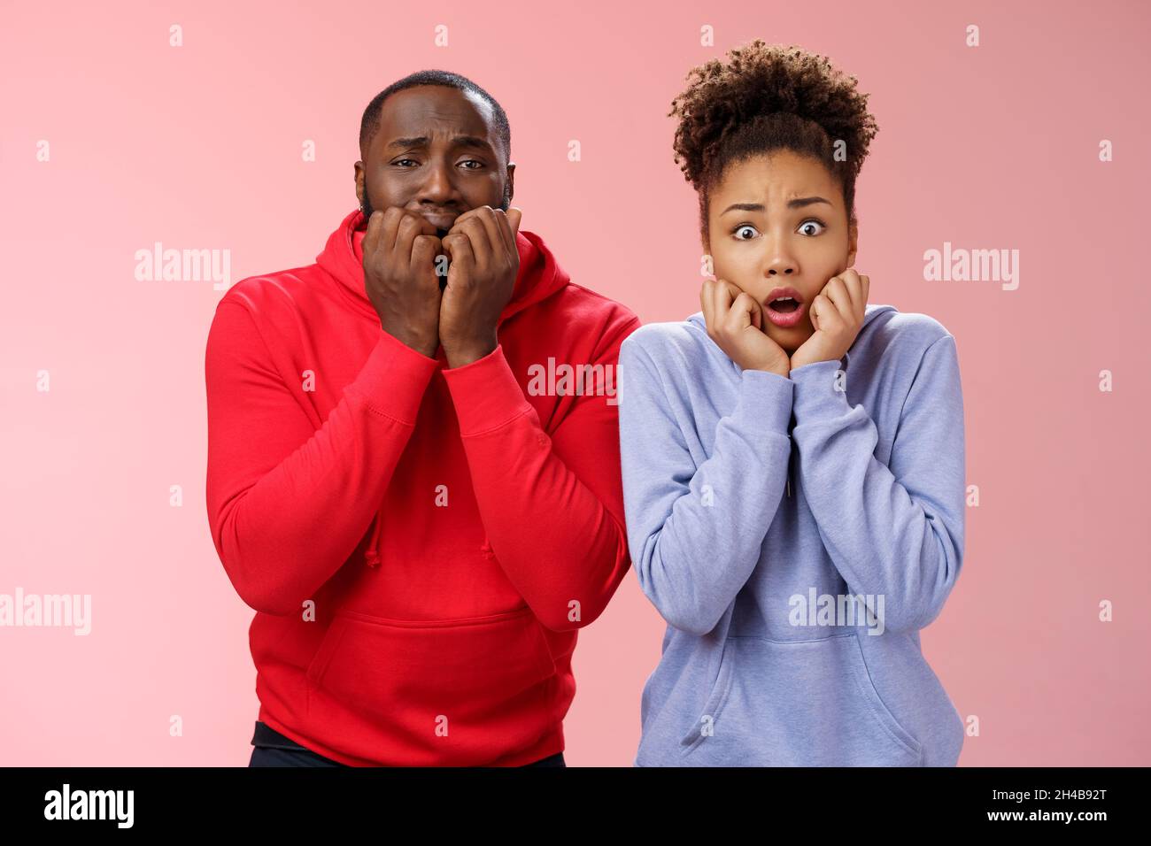 Shocked scared two insecure young african american couple both ...