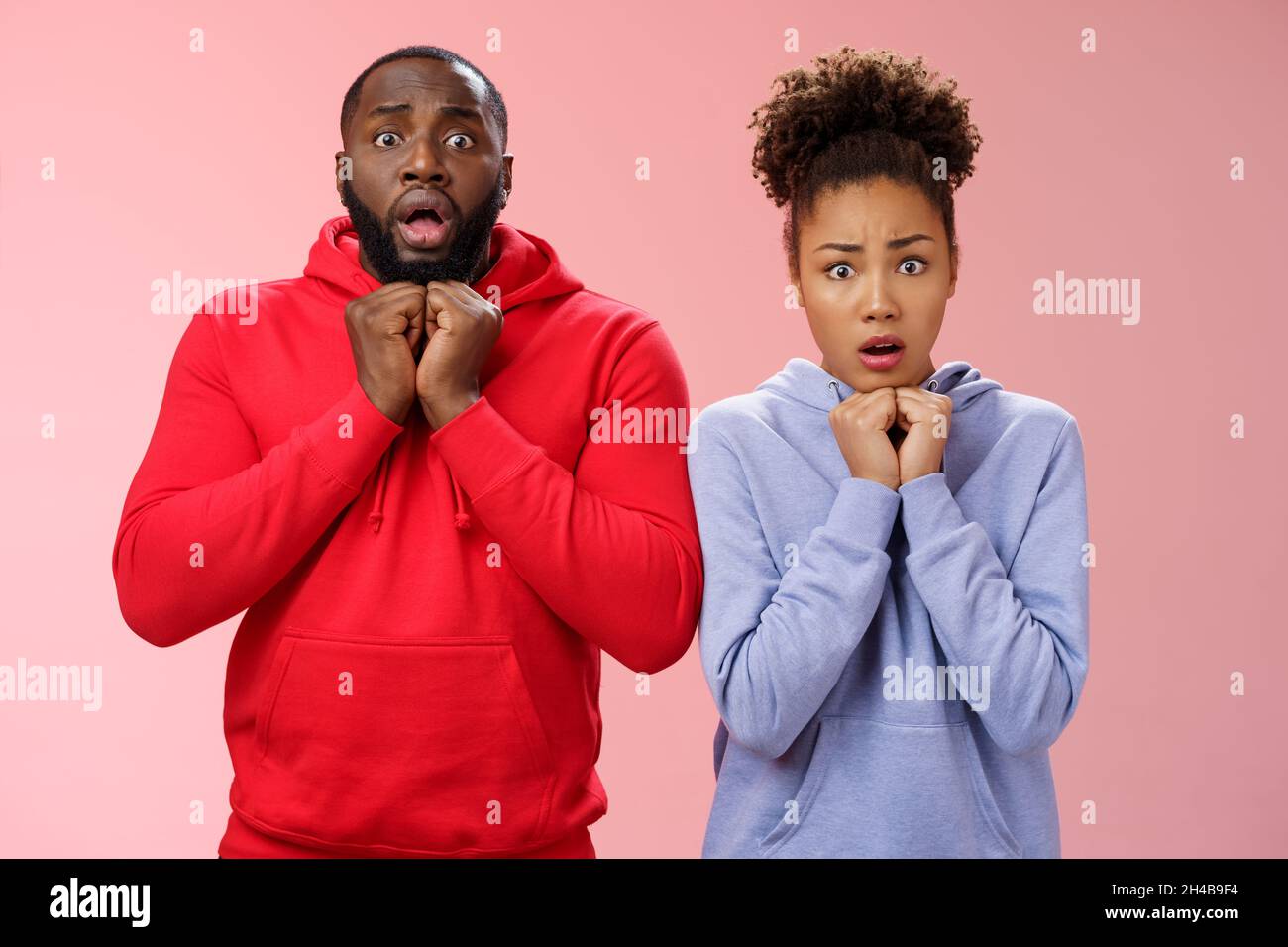 Upset worried two siblings watching together scary disturbing horror ...