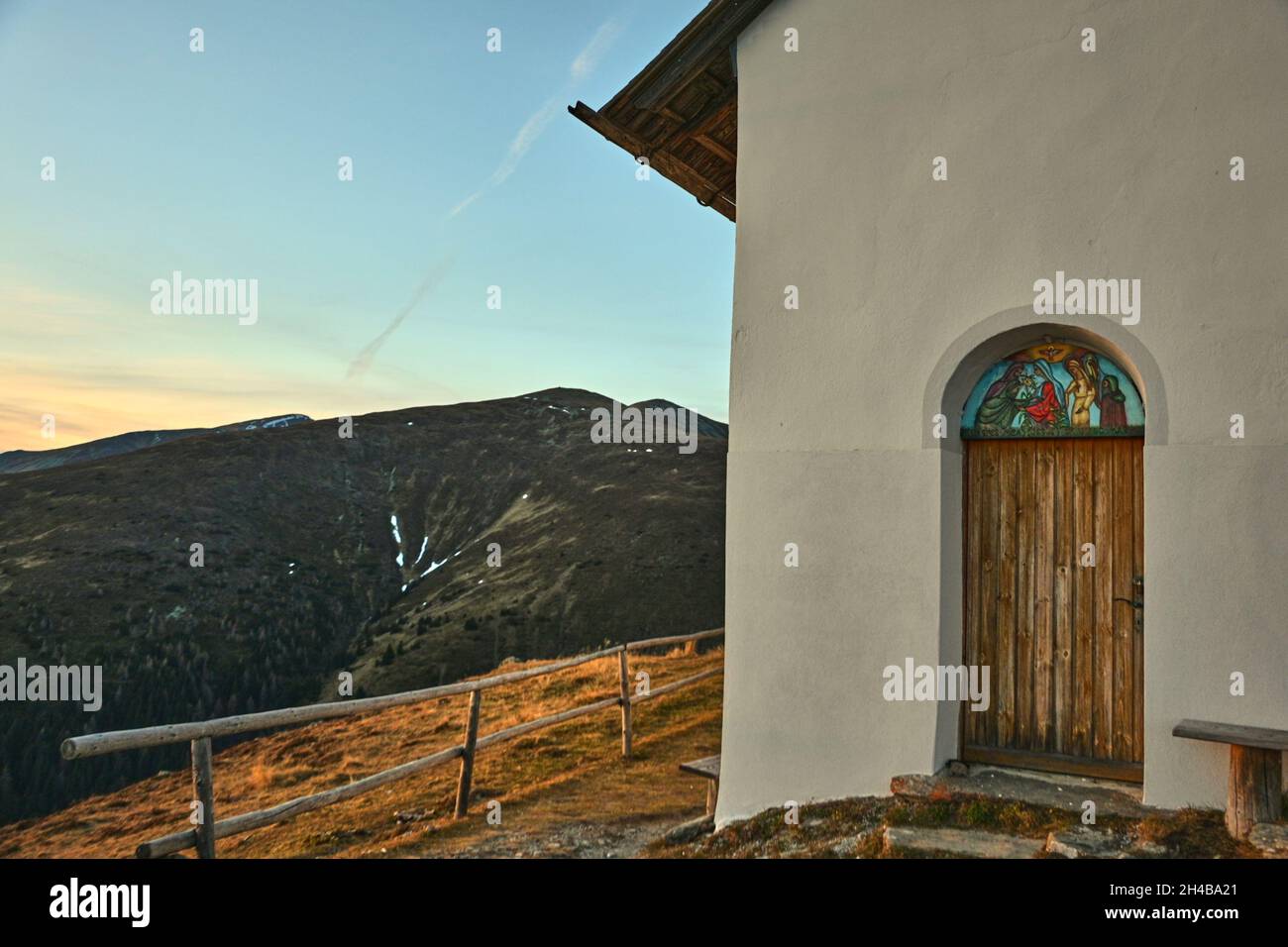 Old building on top of a hill with mountains in the background Stock ...