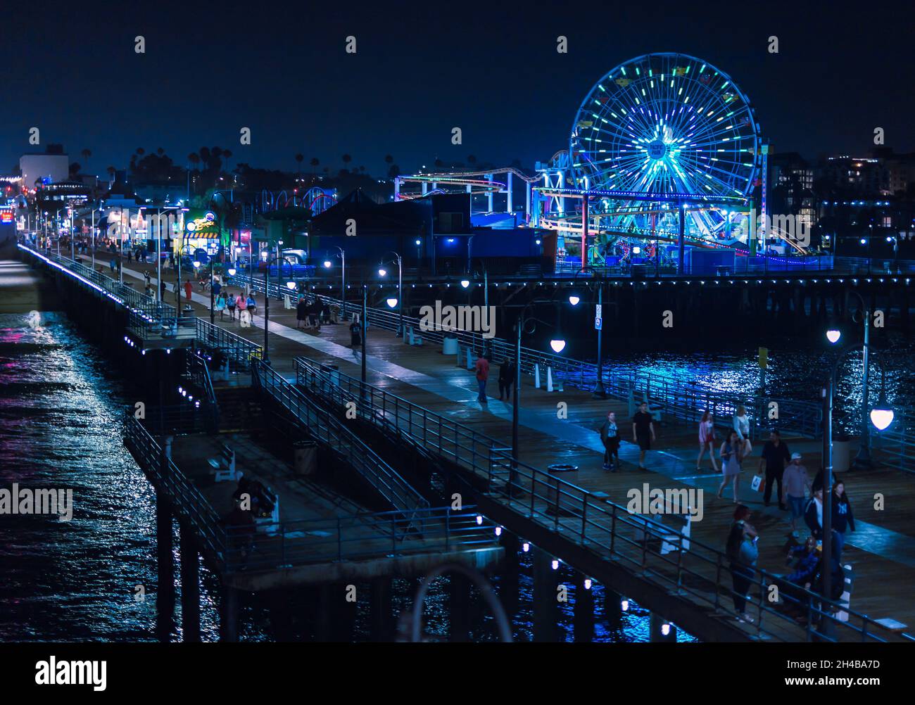 Beautiful night view of a port with attractions Stock Photo - Alamy