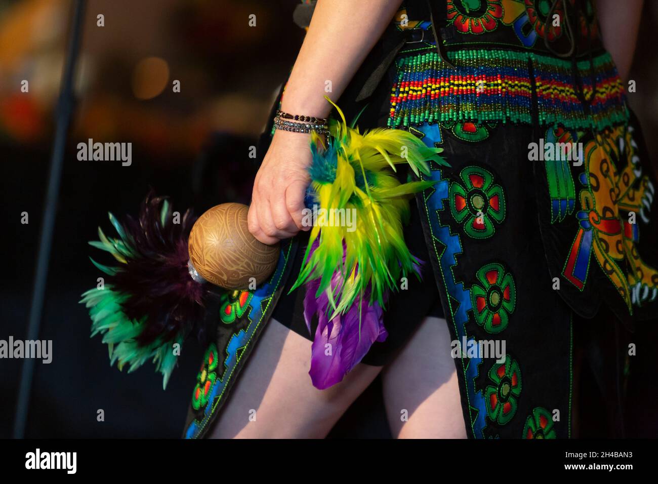 A member of the Huecha Omeyocan Aztec Dancers holds a rattle during a ...