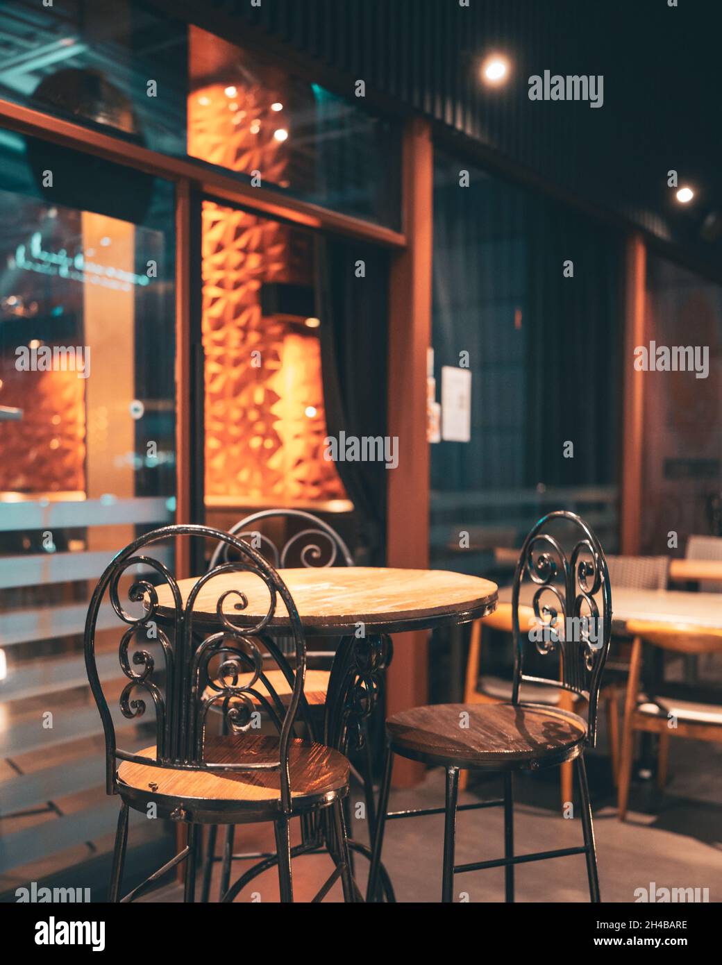 Empty cafe interior with a round table and chairs with a view to the ...