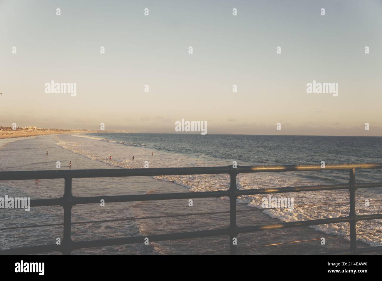 Beautiful view of the beach through the metal railings Stock Photo - Alamy