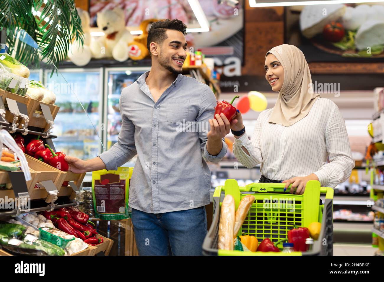 Muslim Couple Enjoying Grocery Shopping Together Buying Fresh ...