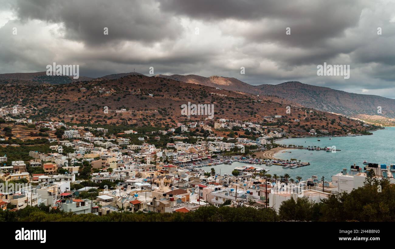 Storm clouds and bands of rain over the Greek tourist resort town of ...