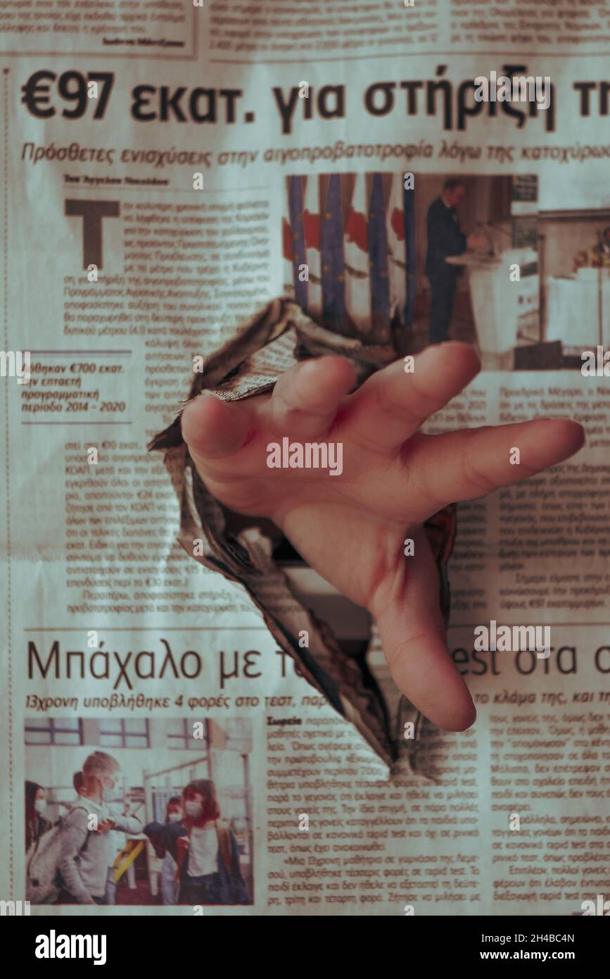 NICOSIA, CYPRUS - Jun 15, 2021: A vertical shot of a male hand reaching ...