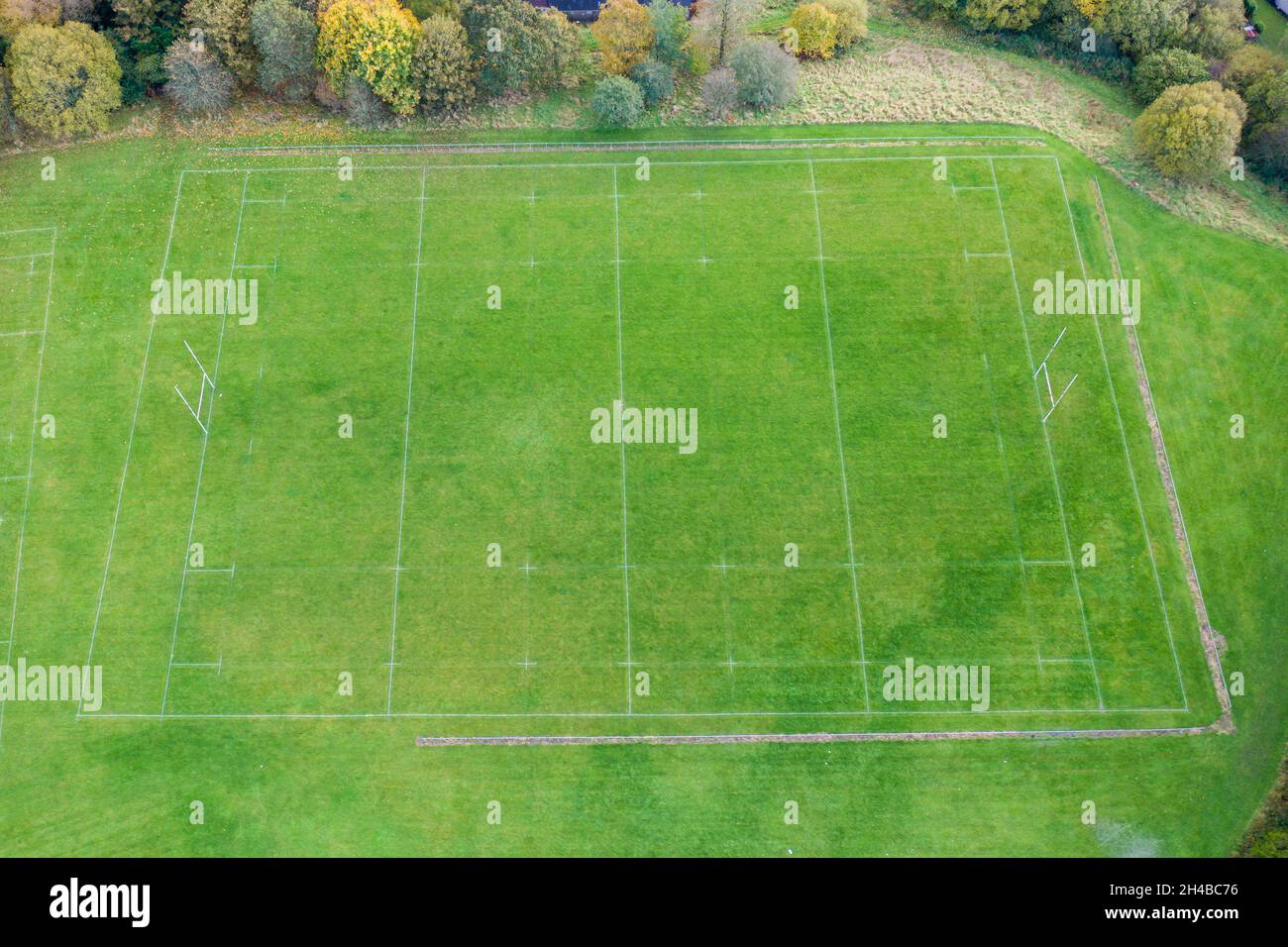 Aerial view of a fully marked Rugby Union pitch surrounded by trees in ...