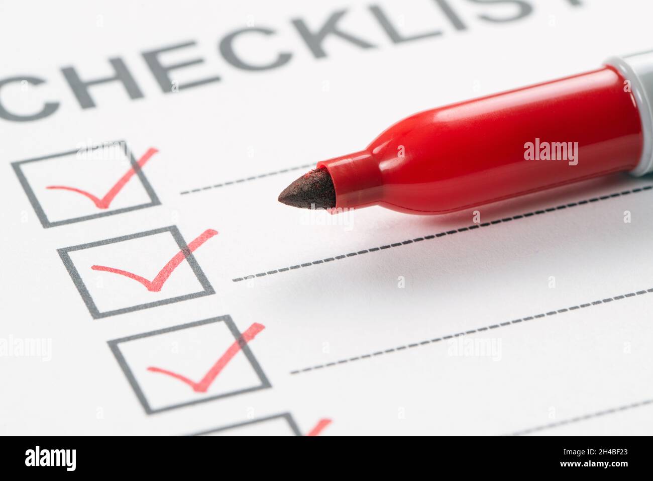 Checklist box with red marker pen Stock Photo - Alamy