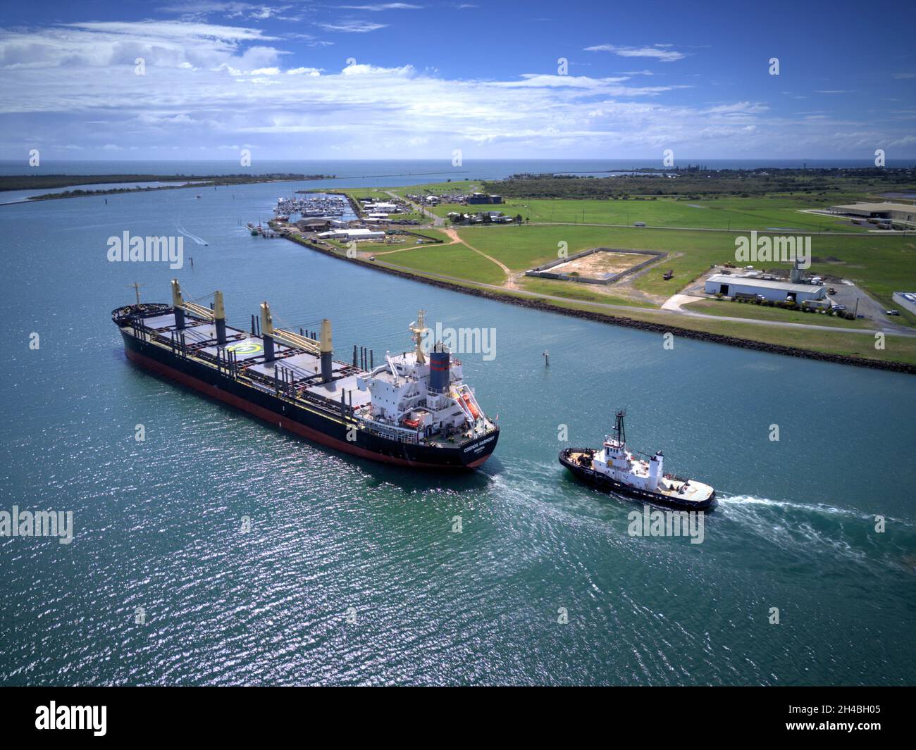 Aerial of MV Cosmo Harmony cargo vessel departing with a load of raw ...