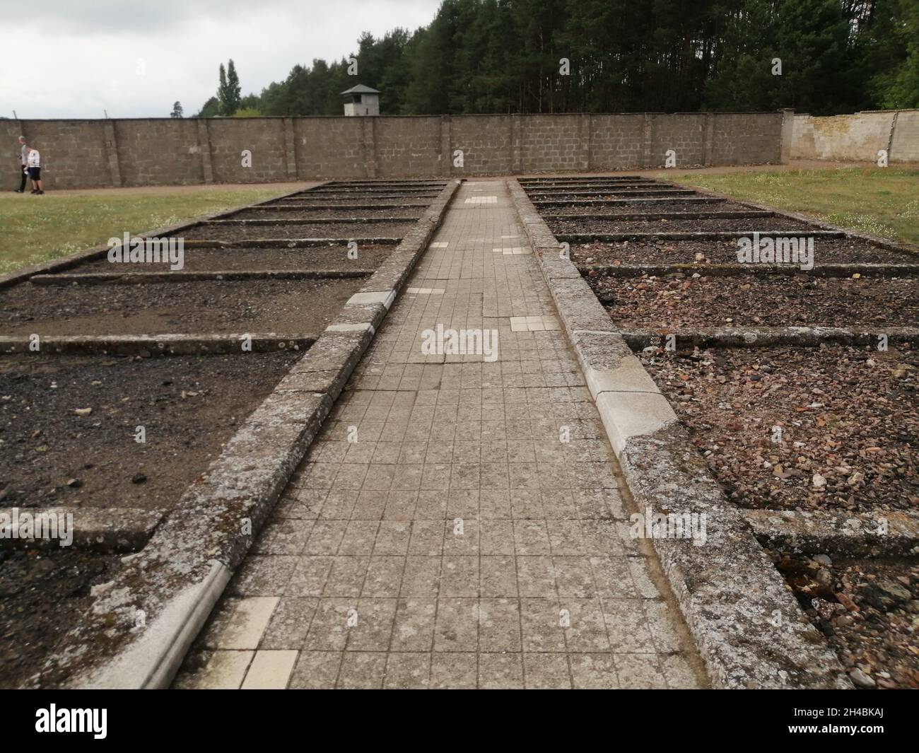An empty brick road and small side plots filled with pebbles Stock ...