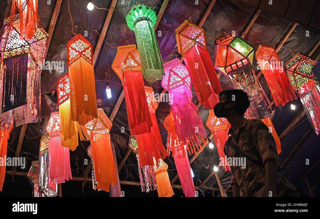 Mumbai, India. 01st Nov, 2021. A man looks at lanterns hanging at ...