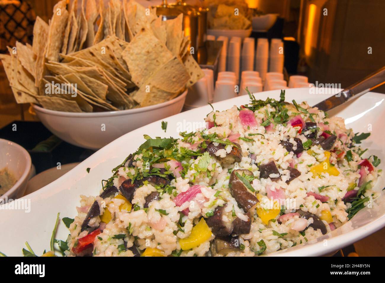 Vegetable risotto is served at a dinner buffet at an event Stock Photo ...