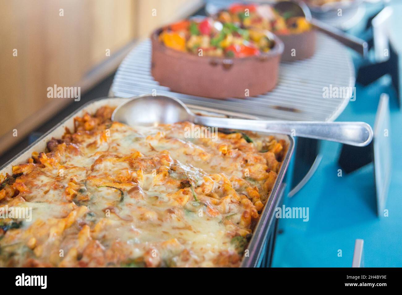 Lasagne is served at a lunch buffet at an event Stock Photo - Alamy