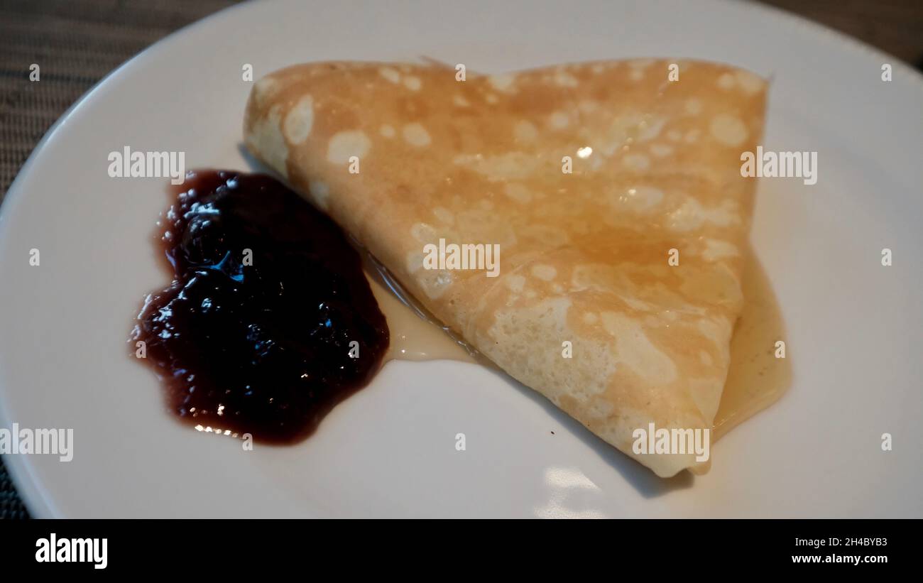 Thin and Light Crepes on a Plate Desserts with Blueberry Topping Stock ...