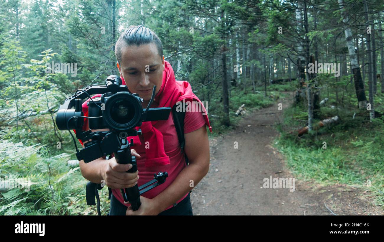 Professional Videographer Holding DSLR Camera on 3-axis Gimbal ...