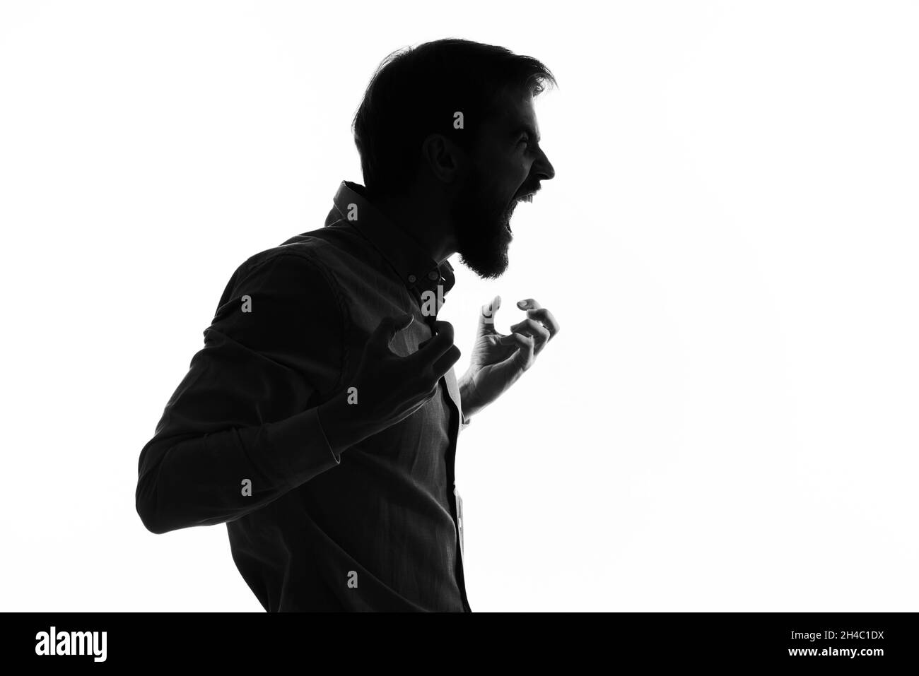 The man in a suit with a pistol in hand crime hand gesture posing ...