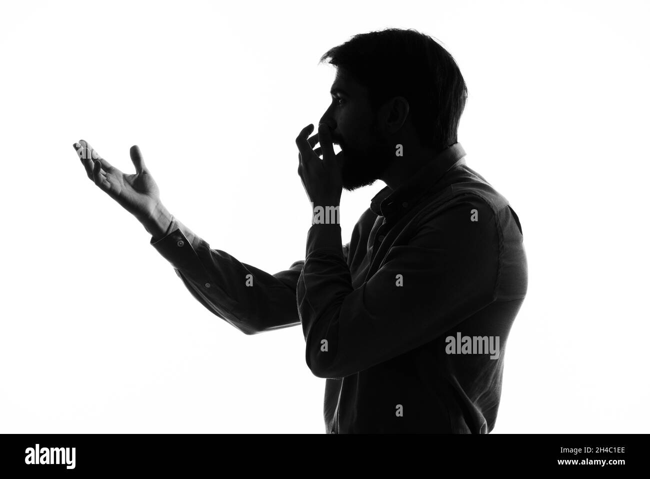 The man in a suit with a pistol in hand crime hand gesture isolated ...