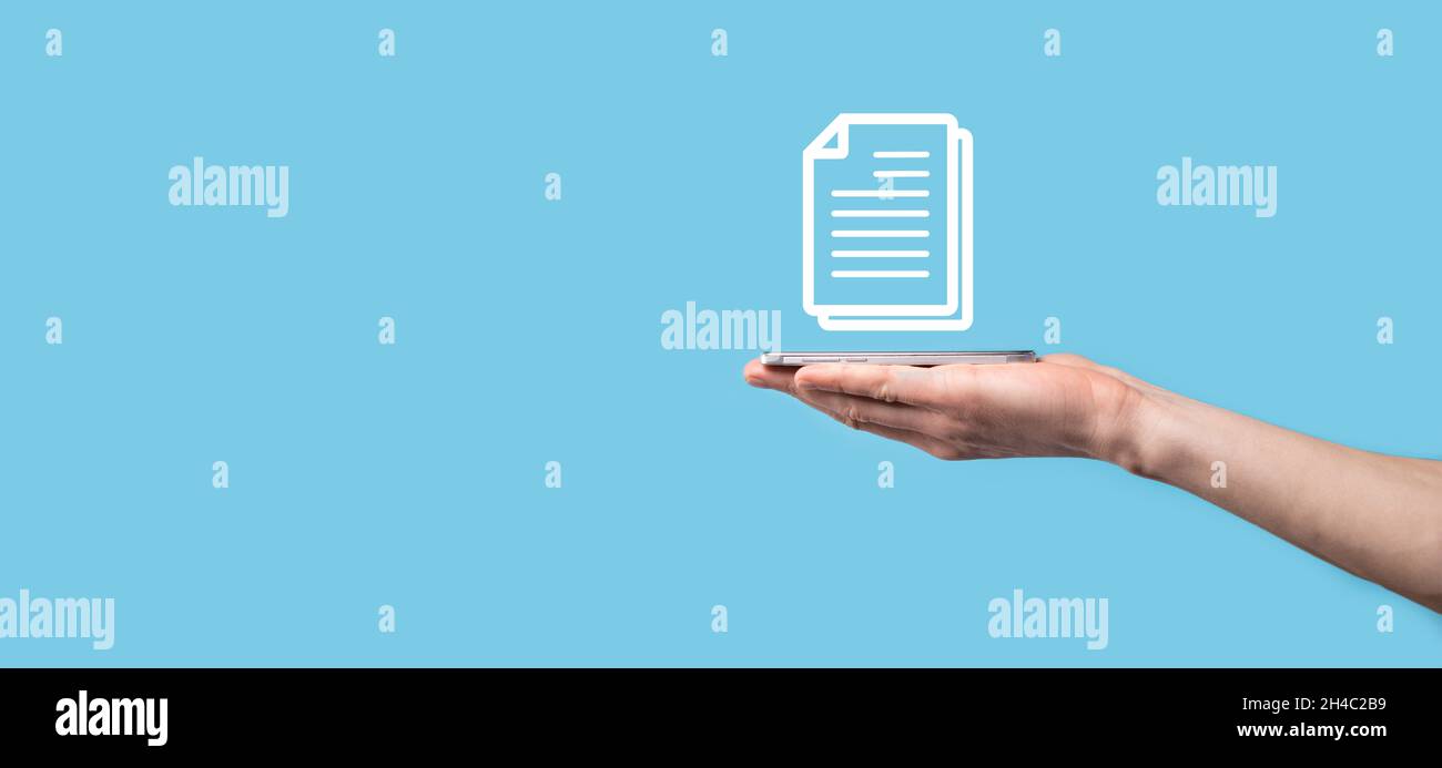 Male hand holding a document icon on blue background. Document ...