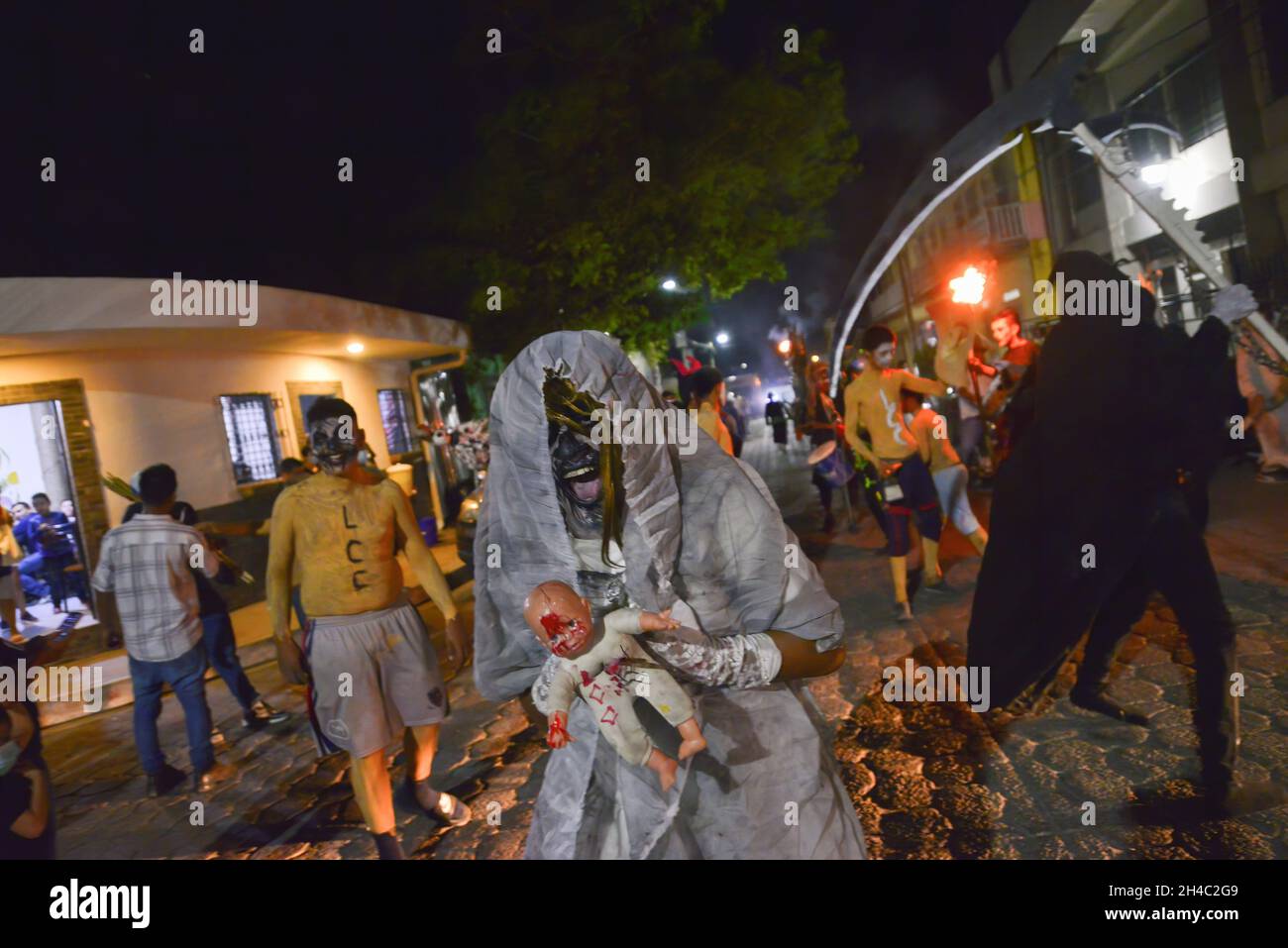 Tonacatepeque, El Salvador. 01st Nov, 2021. A reveler gestures while ...