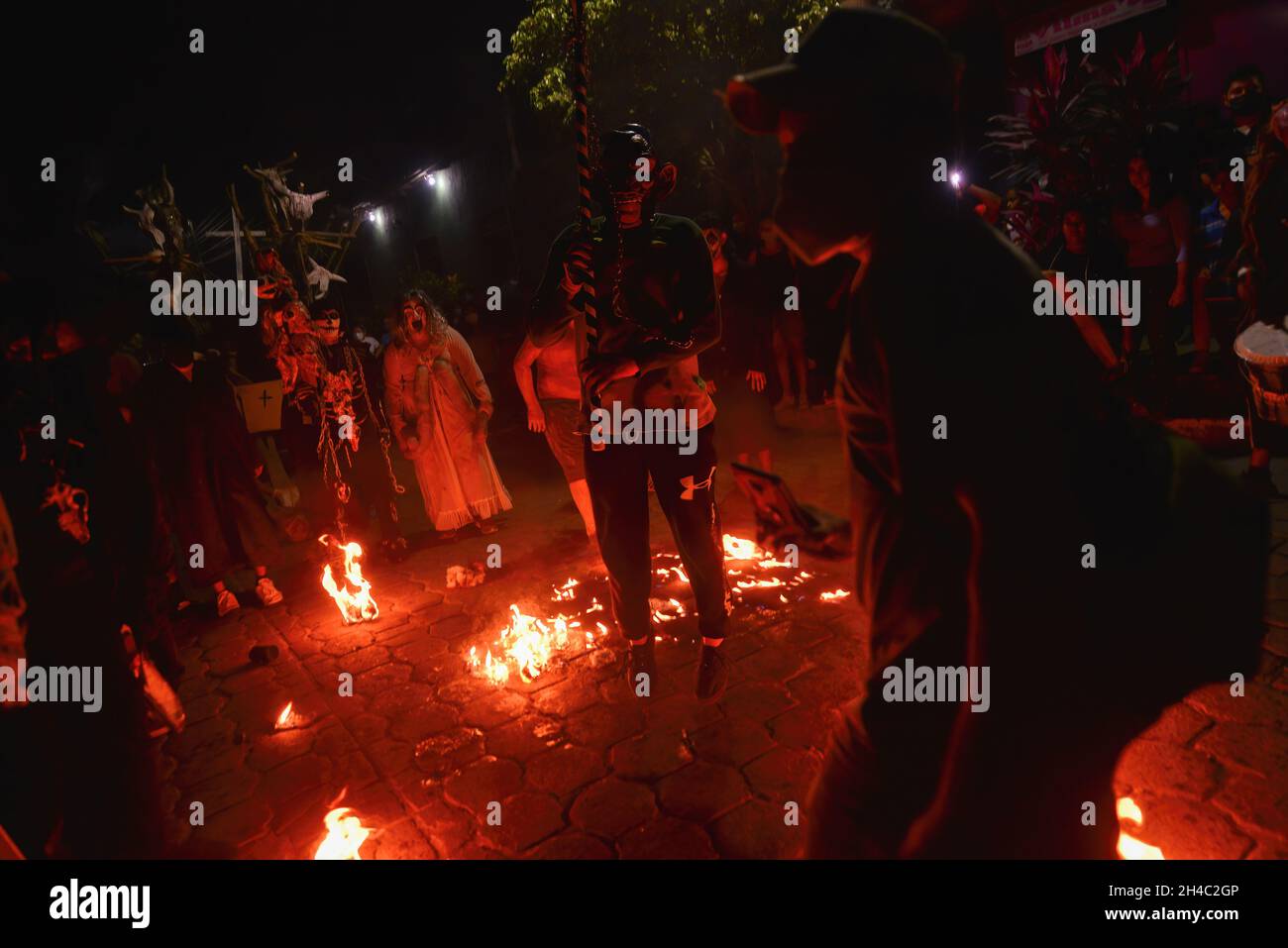 Tonacatepeque, El Salvador. 01st Nov, 2021. Revelers gesture while ...