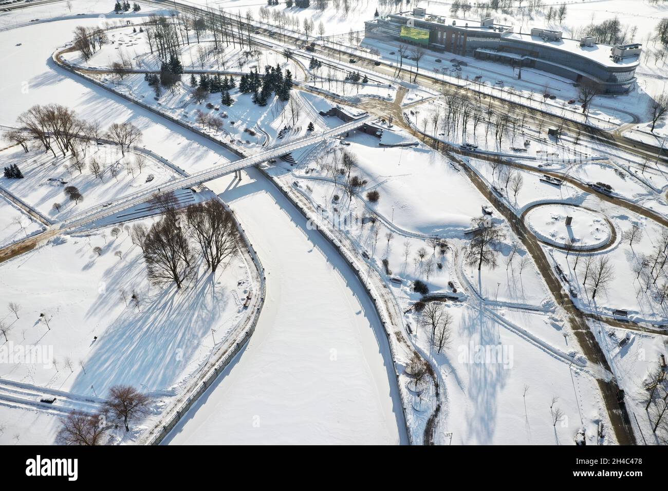 Top view of the pedestrian bridge over the frozen Svisloch river in ...