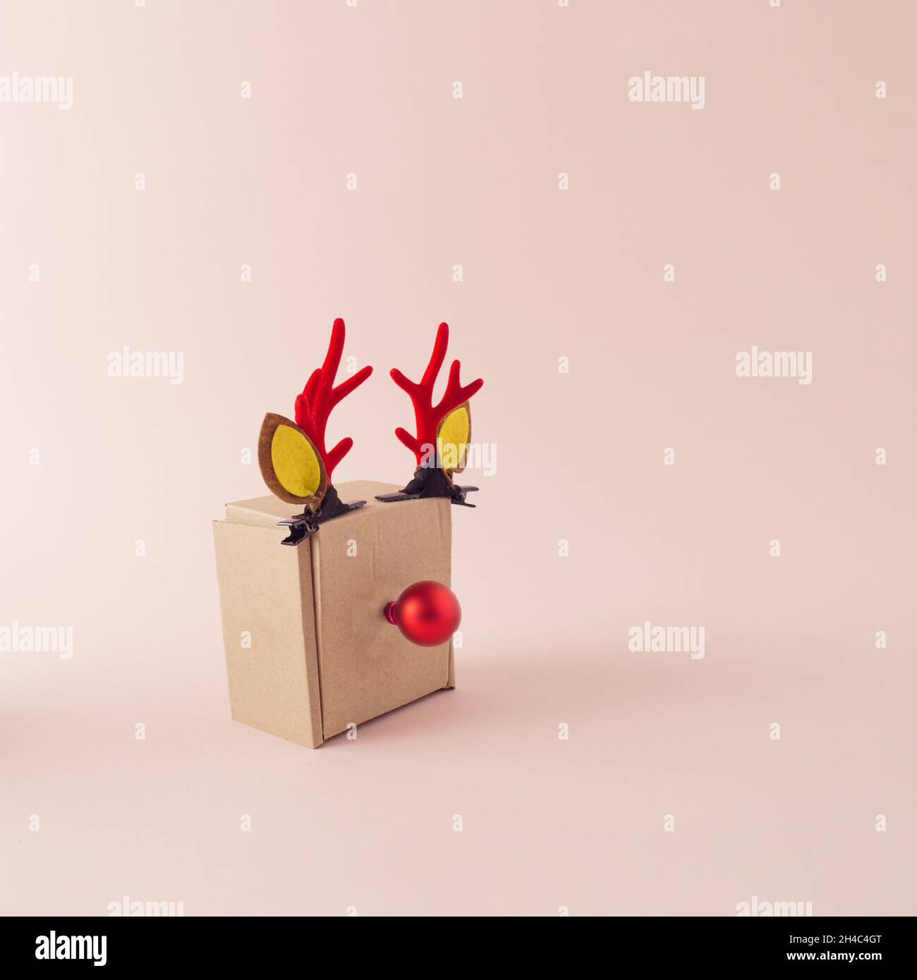 Cardboard box with reindeer horns and red nose. New Year's mood Stock ...