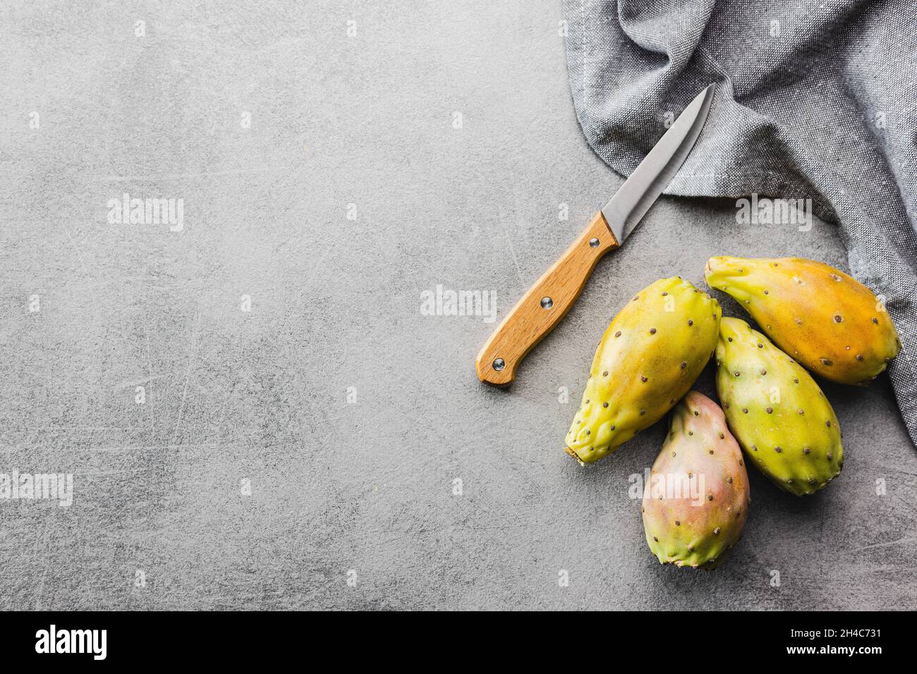 Raw prickly pears. Opuntia or indian fig cactus on kitchen table. Top ...