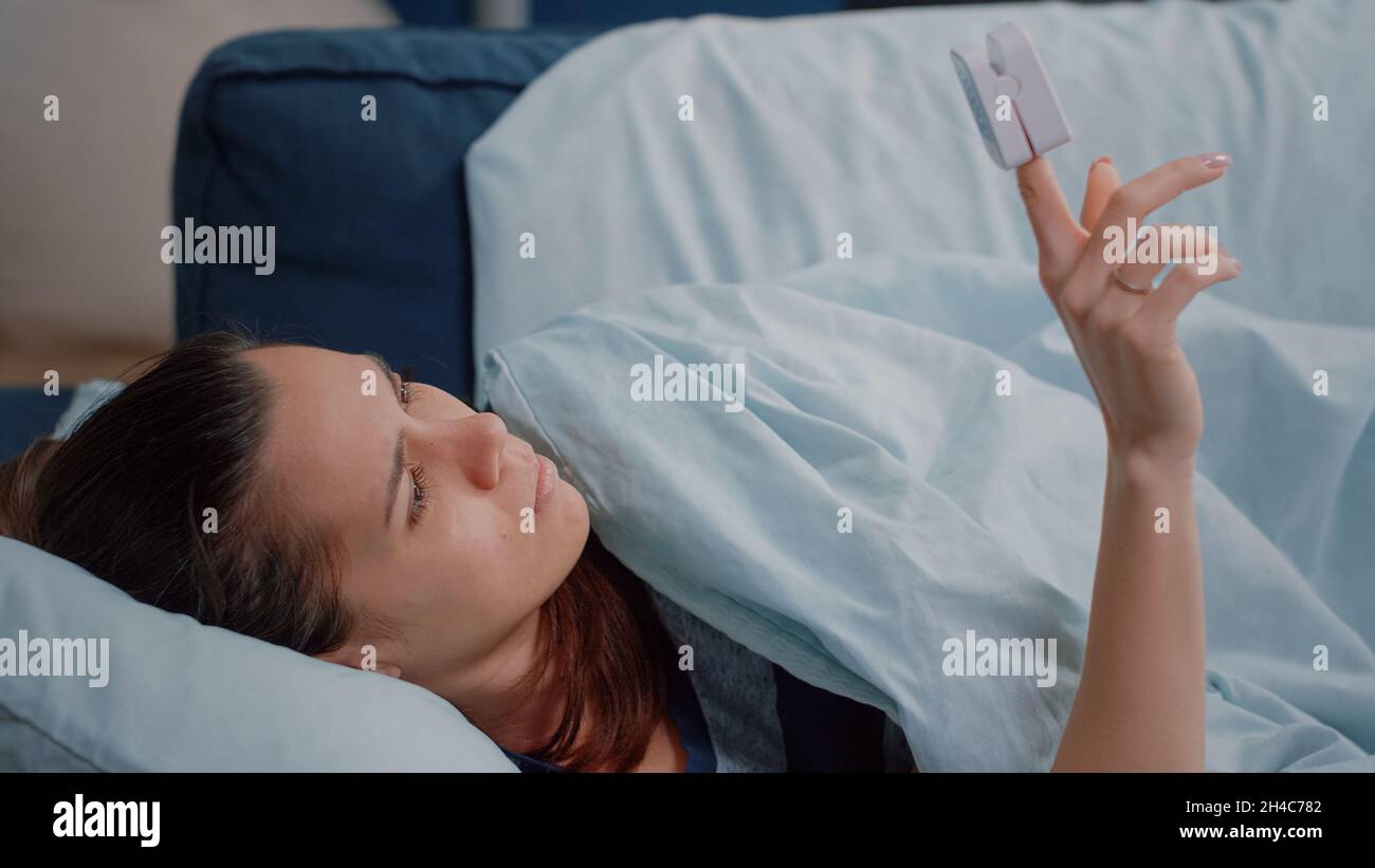 Sick person fever using oximeter hi-res stock photography and images ...