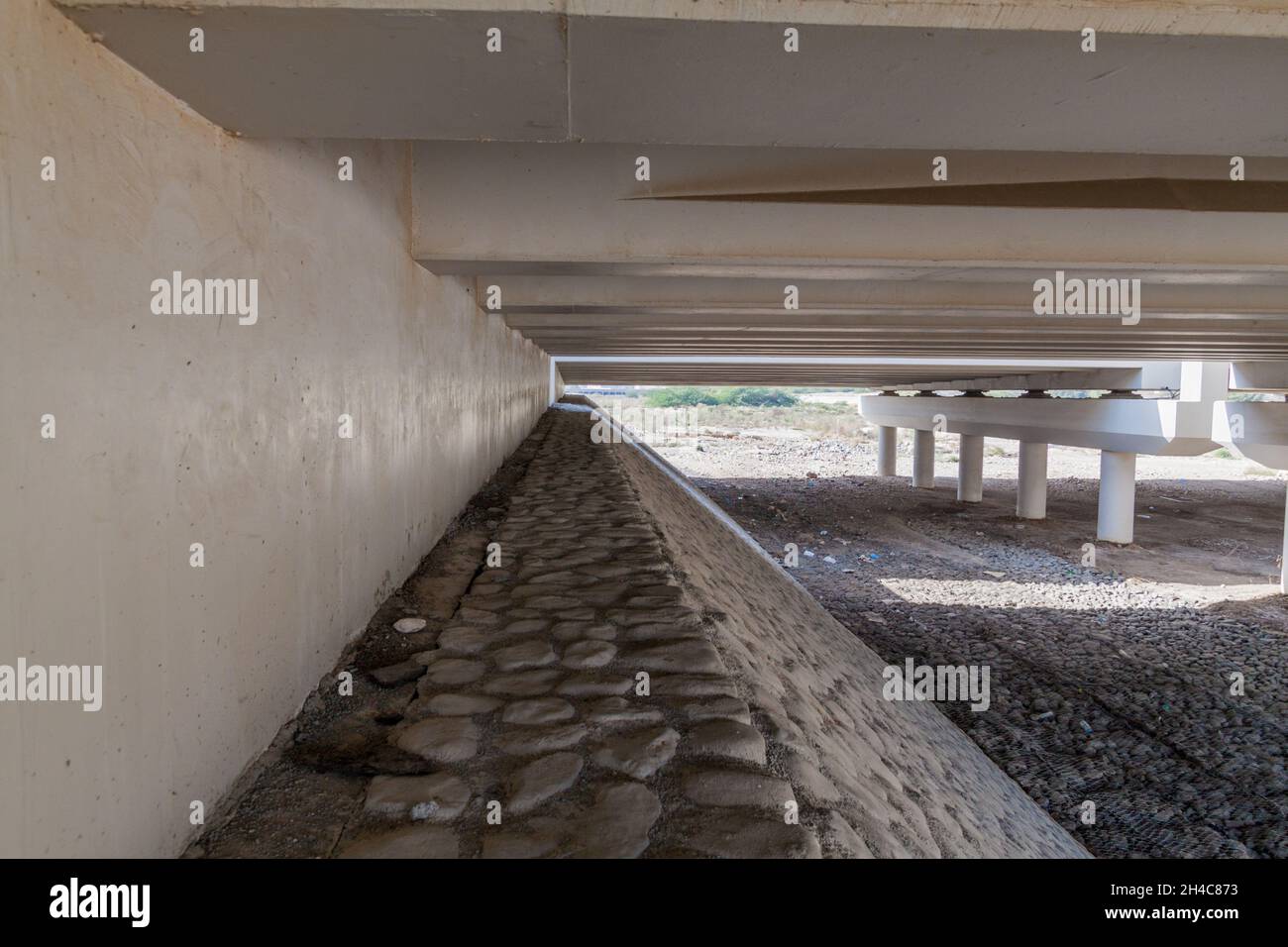 Bridge of Sultan Qaboos street over a small wadi in Muscat, Oman Stock ...