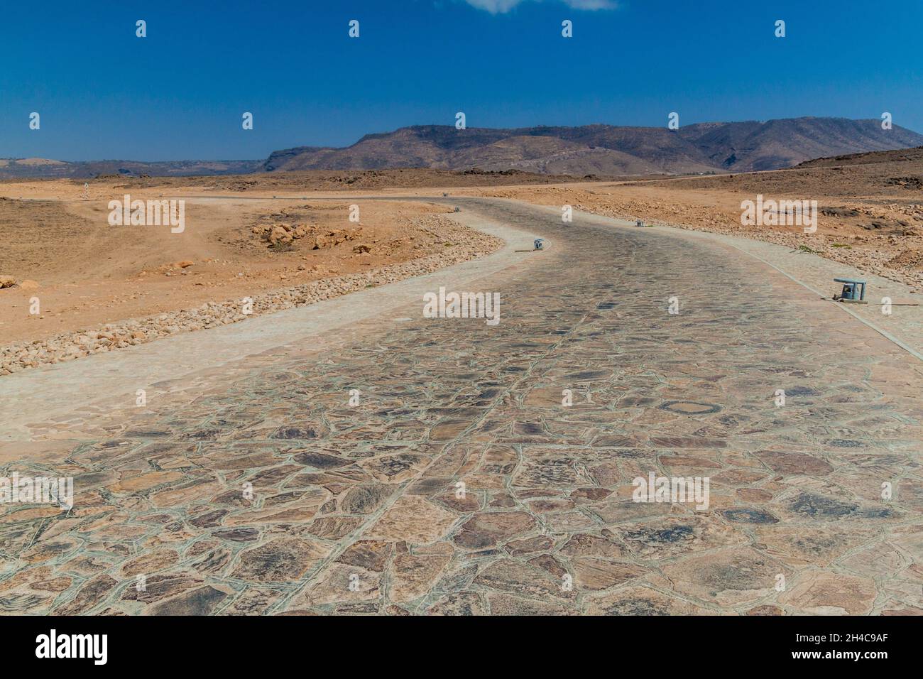 Road to Sumhuram Archaeological Park with ruins of ancient town Khor ...