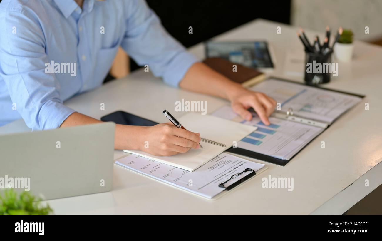 Male executive writing in hi-res stock photography and images - Alamy