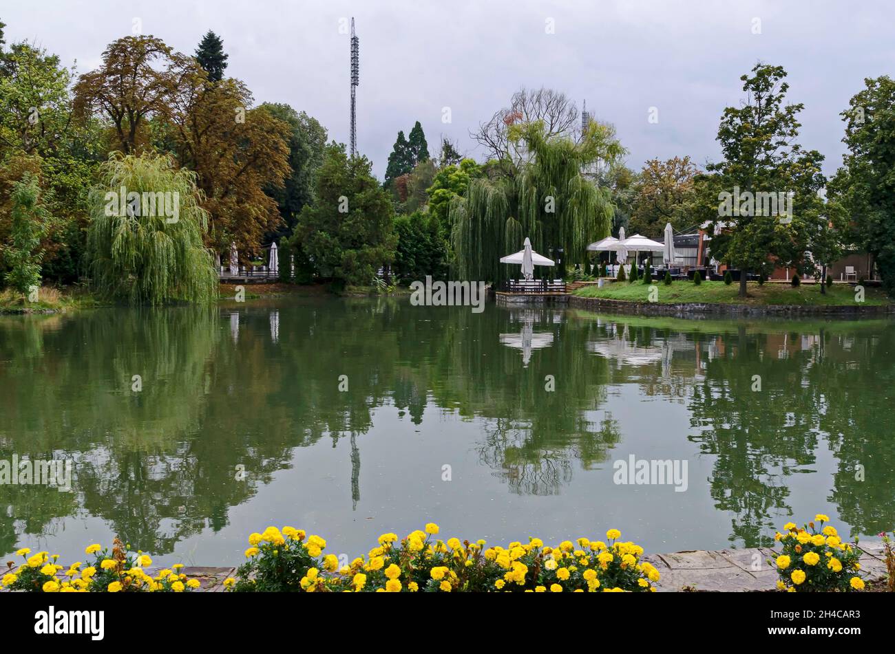 View of a cosy relaxation area under awnings with tables and chairs on ...