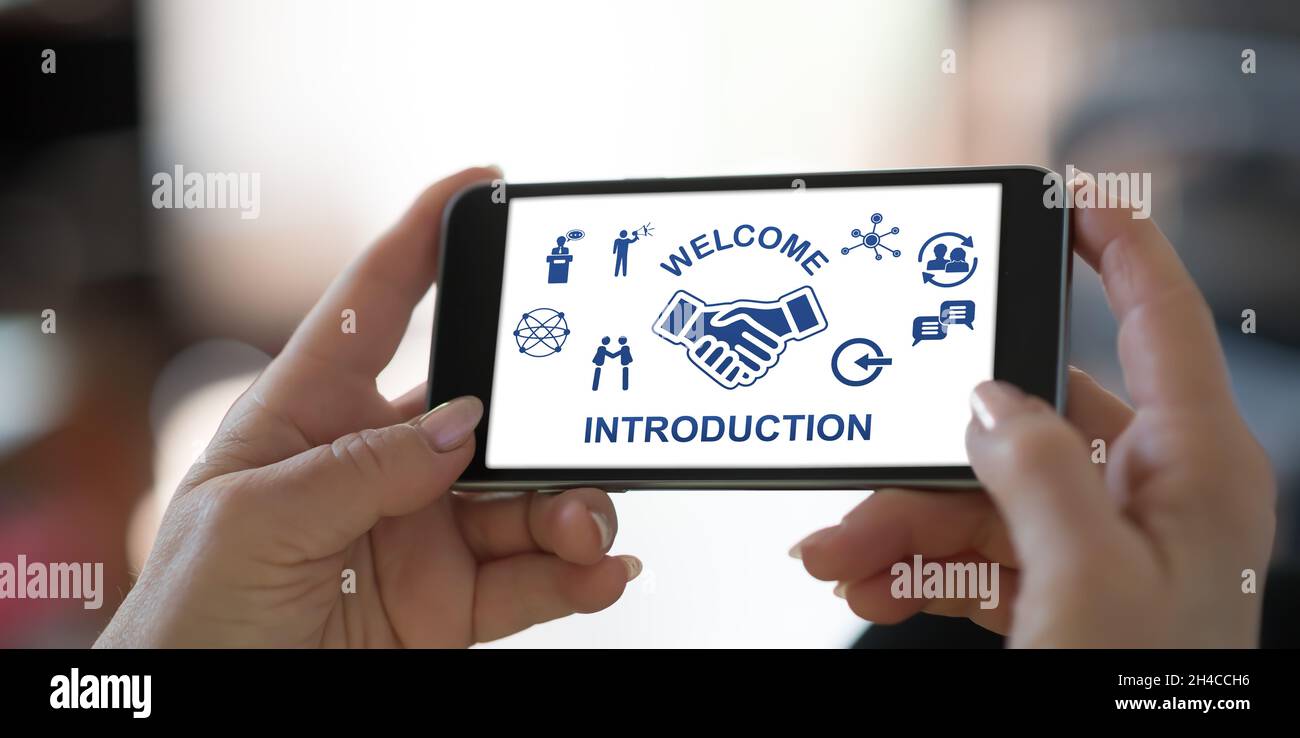 Hand holding a smartphone with introduction concept Stock Photo - Alamy
