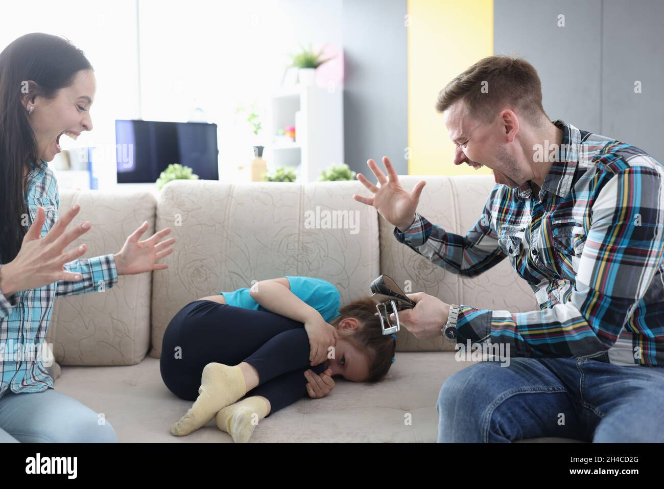 Dad and mom are screaming at their daughter Stock Photo - Alamy