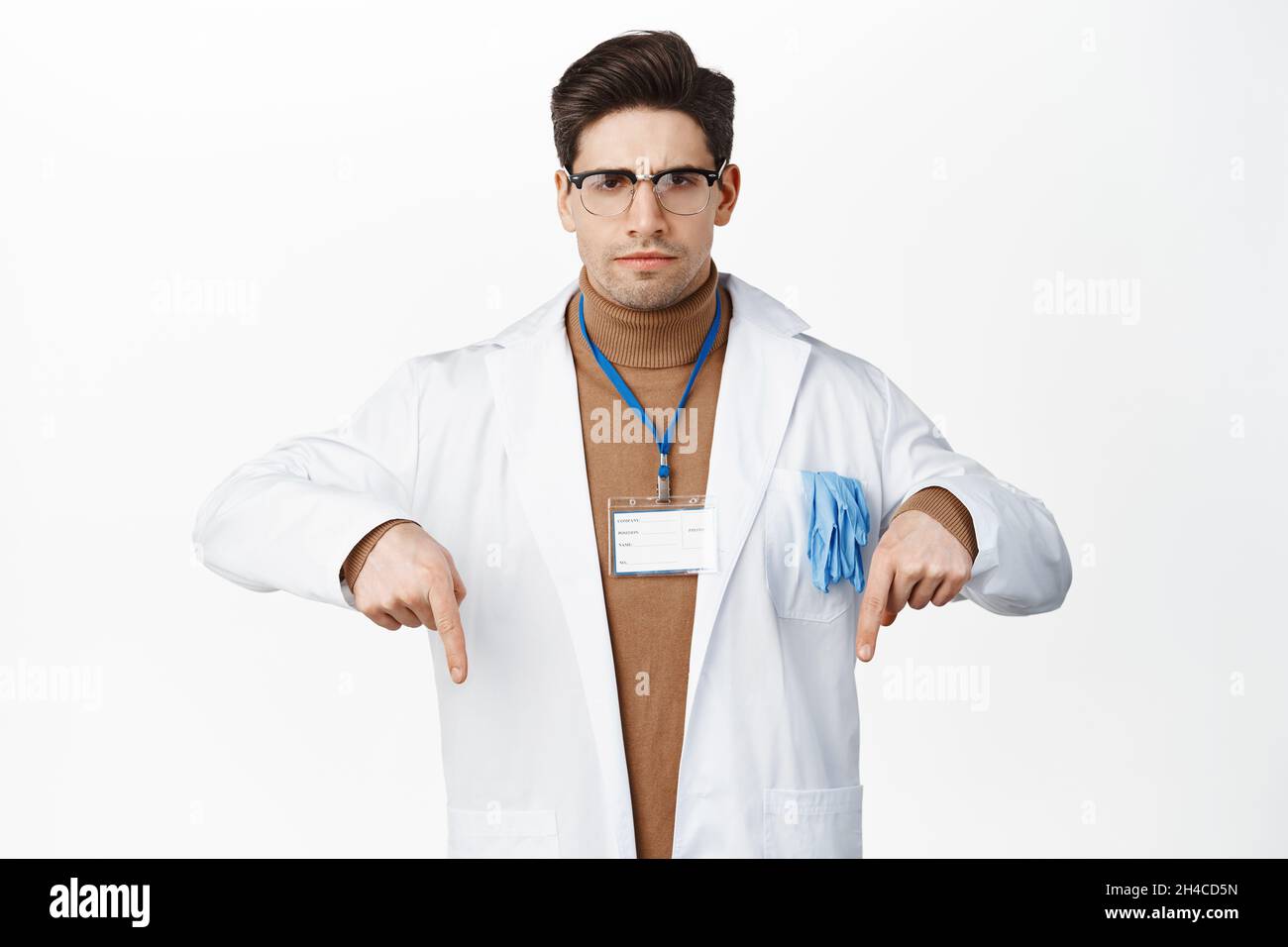 Angry male doctor, looking concerned, medical worker pointing fingers ...