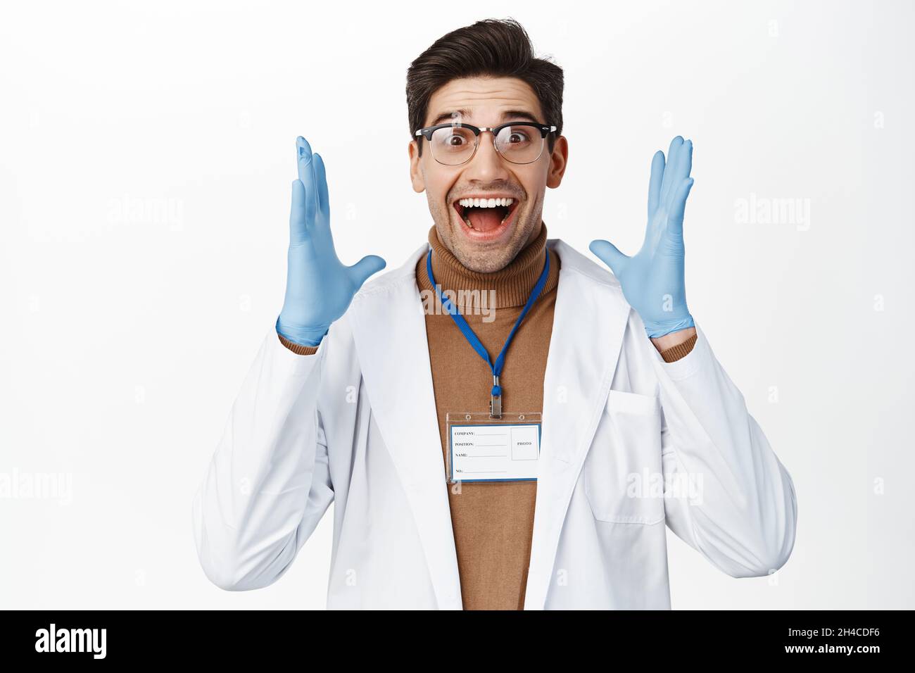 Excited doctor clap hands and smiling amazed, looking ecstatic ...