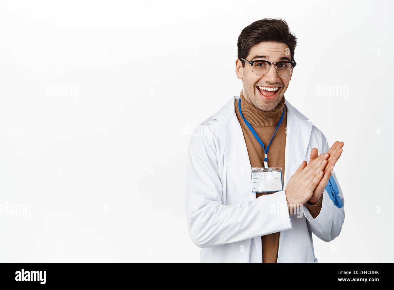 Happy smiling doctor clapping hands, applause and look pleased ...