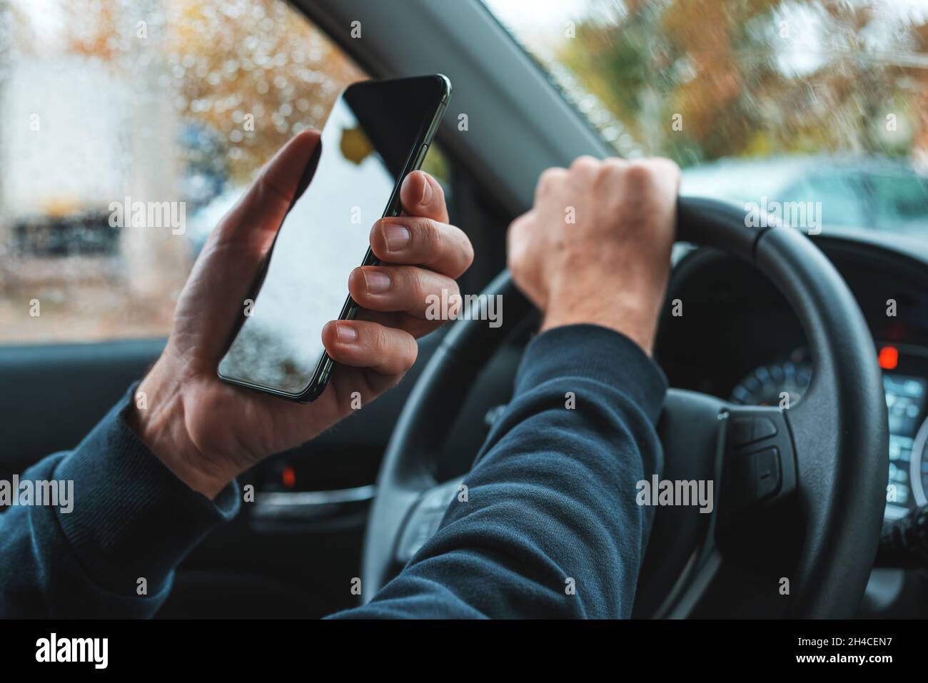 Man driving car raindrops fall hi-res stock photography and images - Alamy