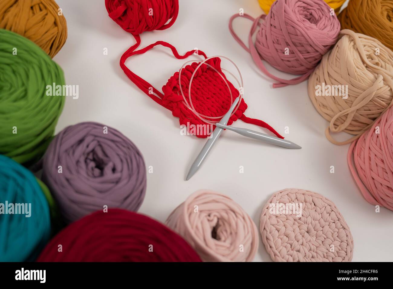 cotton yarn knitting pattern on white table Stock Photo - Alamy