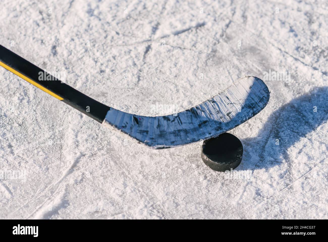 Hockey Puck And Stick On Ice