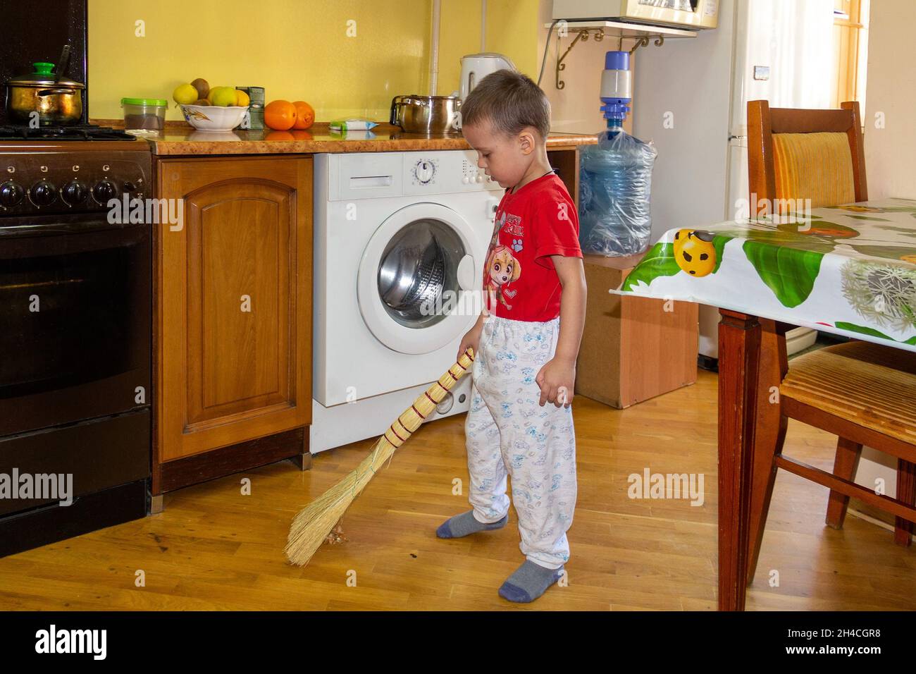 Boy sweeping a room hi-res stock photography and images - Alamy