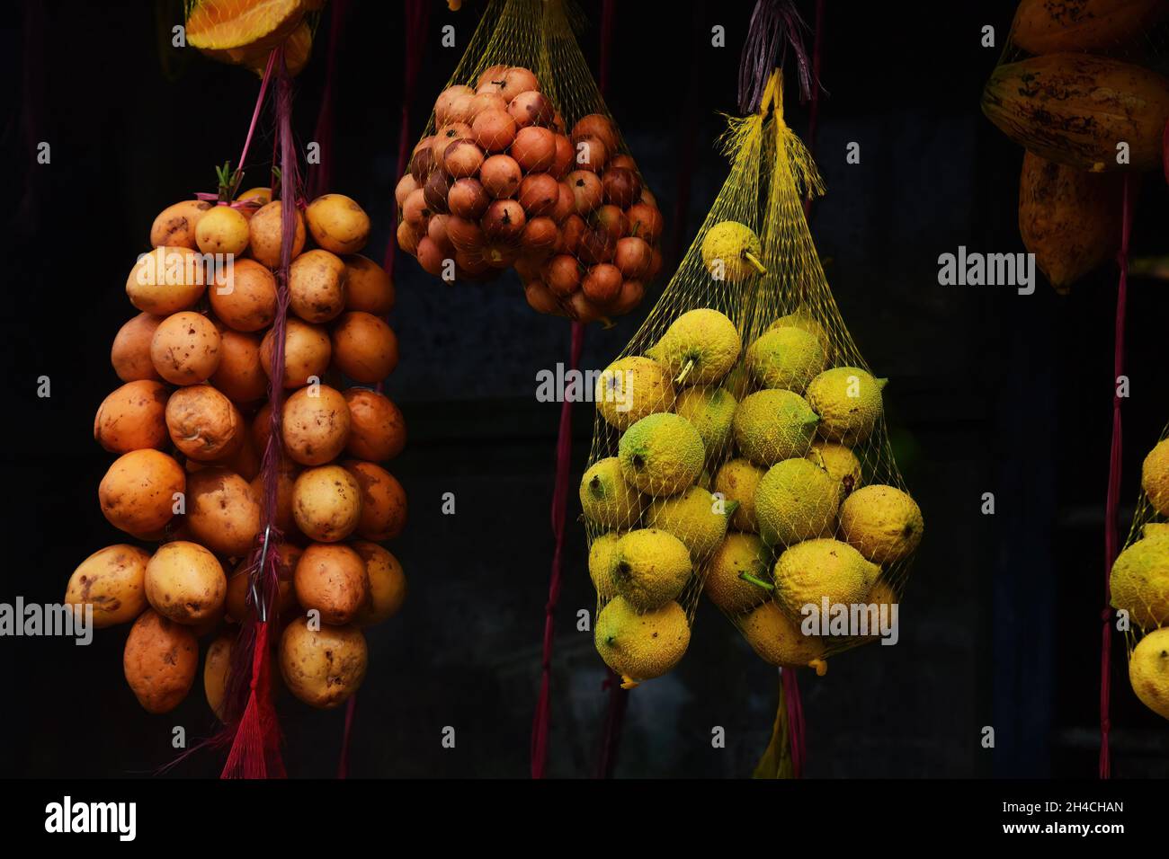 Amazon local fruits hung up infront of a fruit stall in Manaus city ...