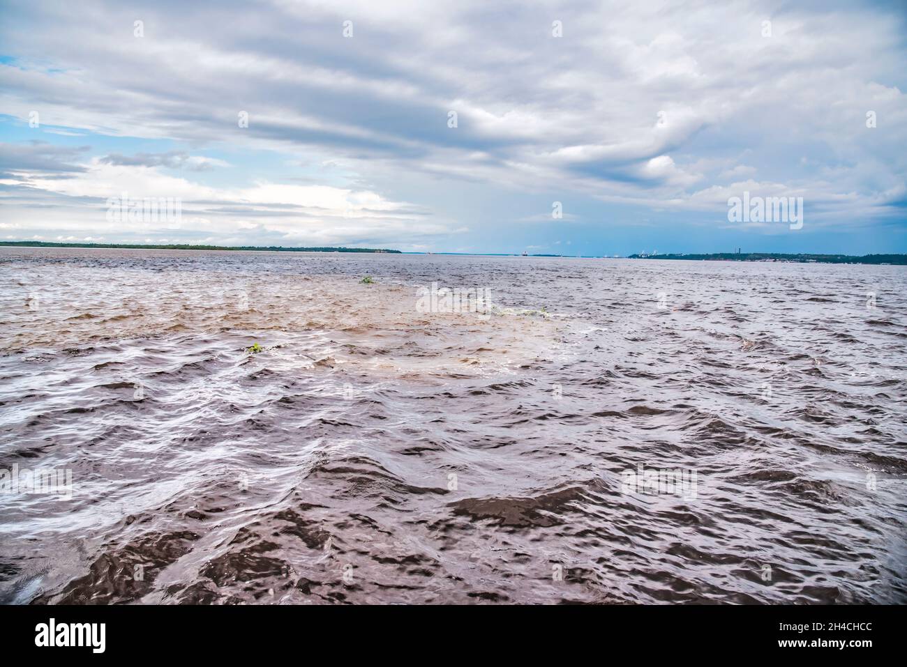 Meeting of Waters of brownish colored Solimoes River and blackish ...