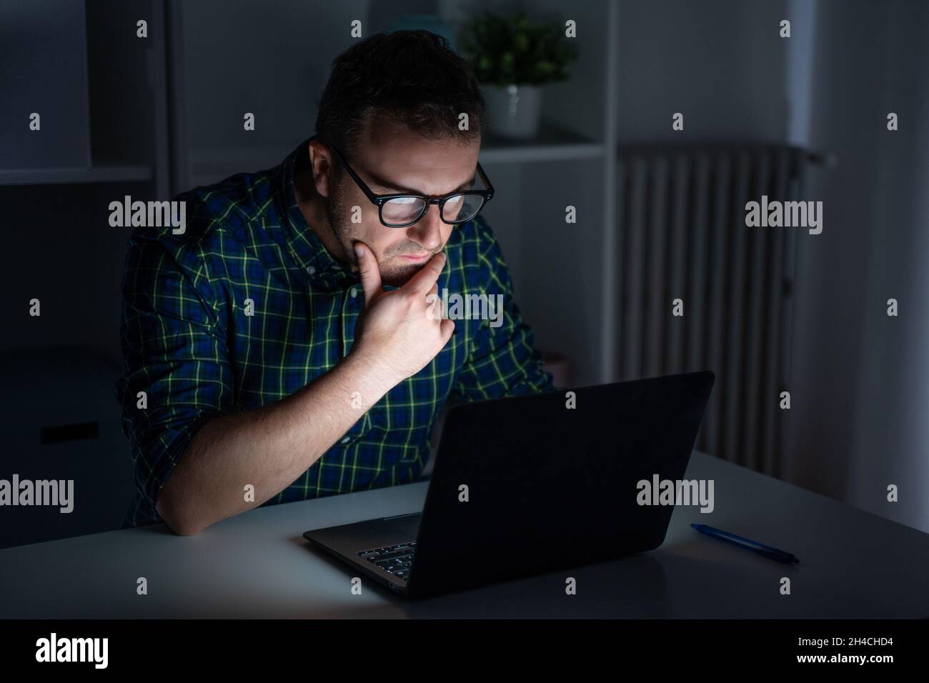 One man portrait using computer late at night Stock Photo - Alamy