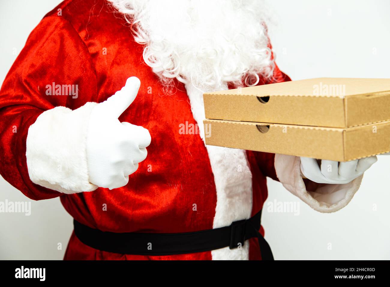 Pizza boxes in the hands of Santa Claus. Christmas fast food delivery ...