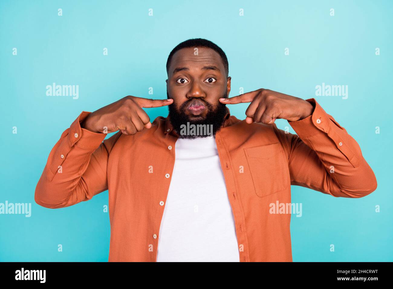 Photo of young black man pouted cheeks hold breath childish playful ...