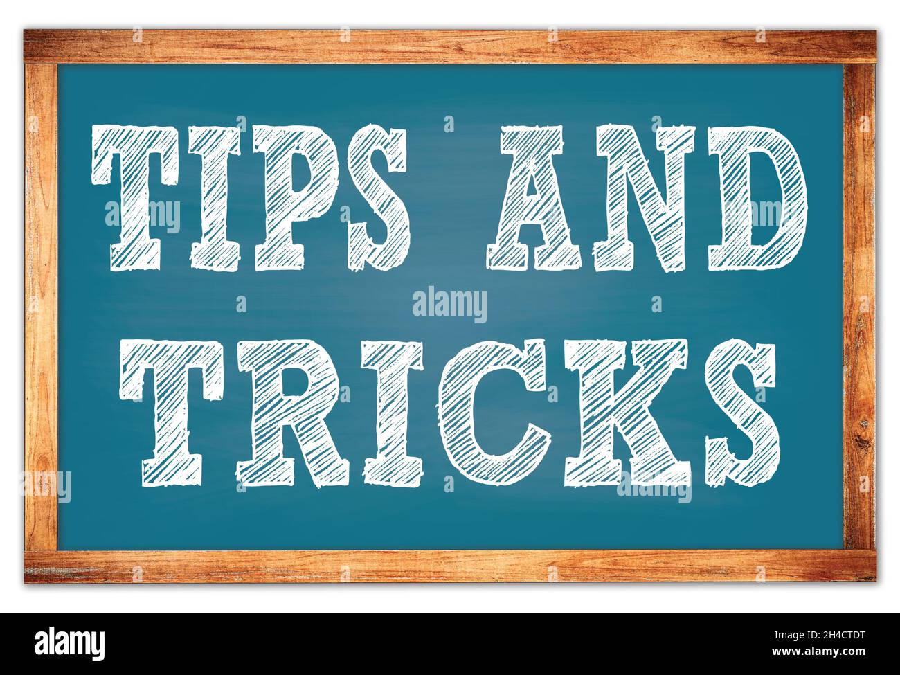 TIPS AND TRICKS written on blue wooden frame school blackboard Stock ...